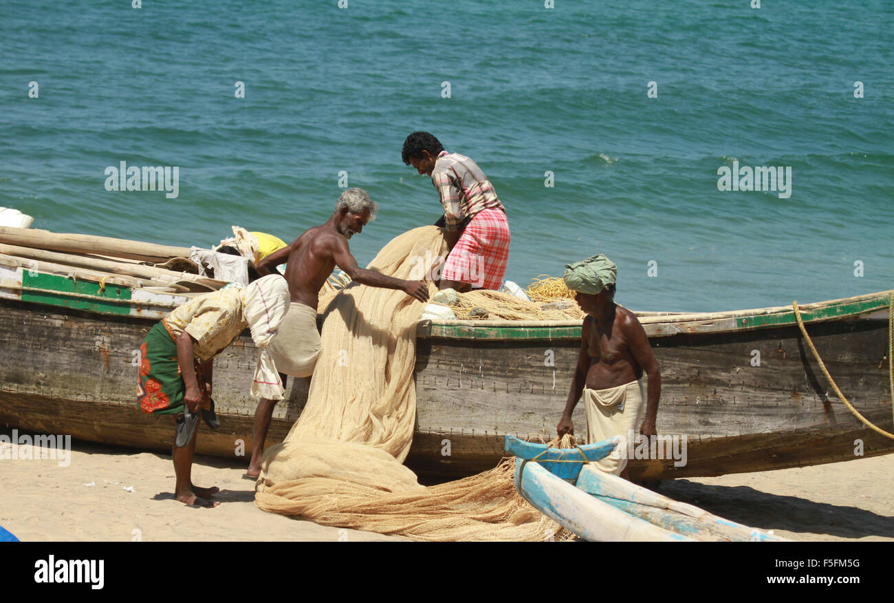 Fishermen preparing their nets for fishing Stock Photo - Alamy
