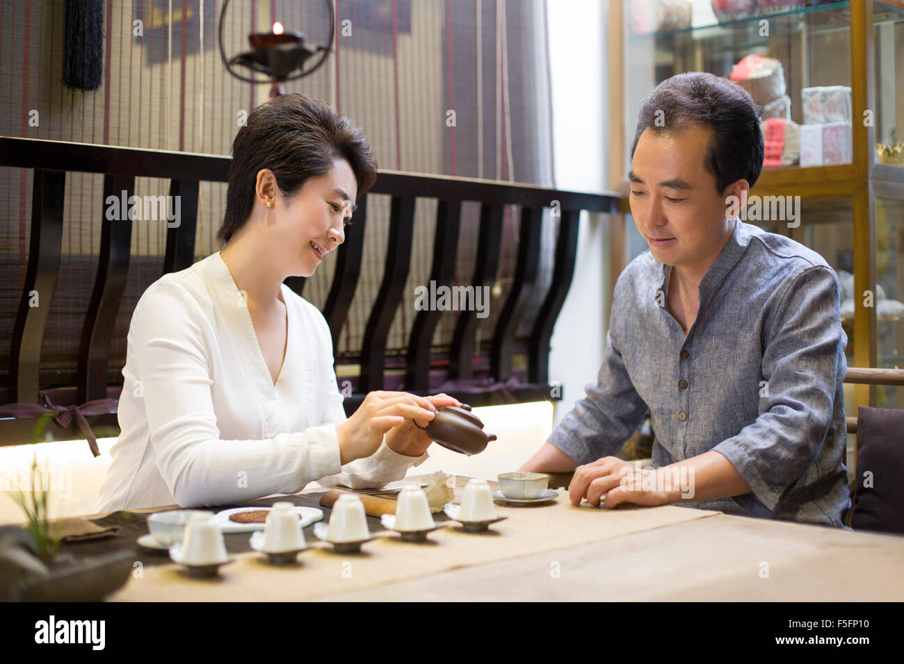 Friends drinking tea in tea room Stock Photo - Alamy