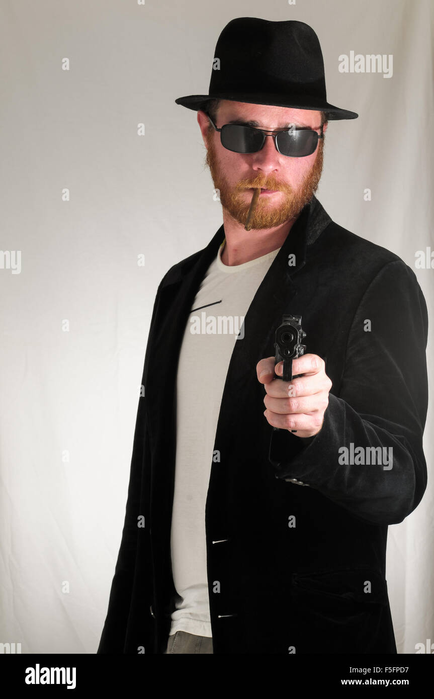 Man Holding a Pistol Gun Stock Photo - Alamy