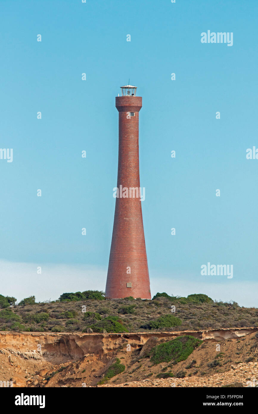 Unusual & elegant red brick Troubridge Hill lighthouse rising above low ...