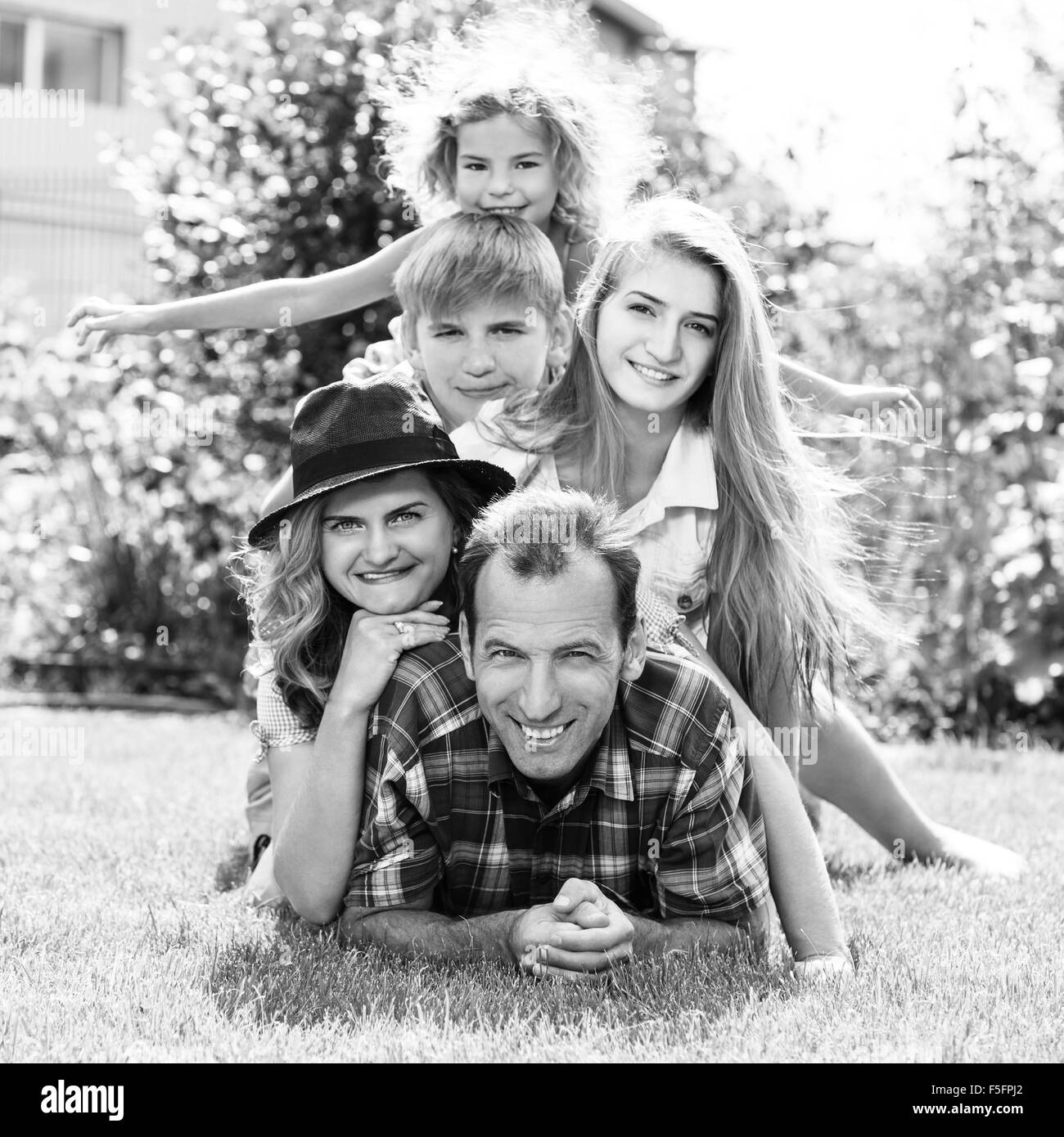 Happy family having weekend in summer park Stock Photo - Alamy