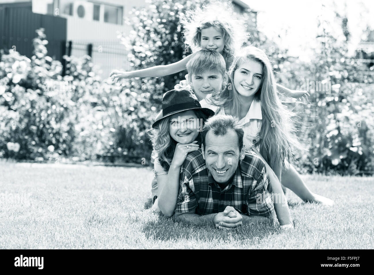 Happy family having weekend in summer park Stock Photo - Alamy