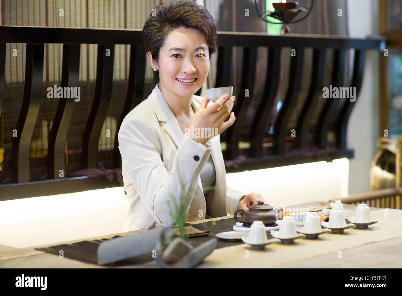 Sitting at a tea table in front row hi-res stock photography and images ...
