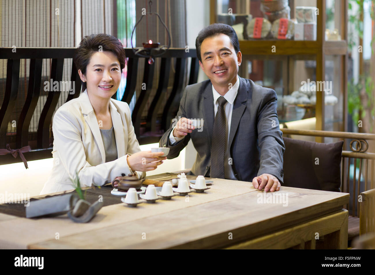 Holding sitting food and drink eating in a row hi-res stock photography ...