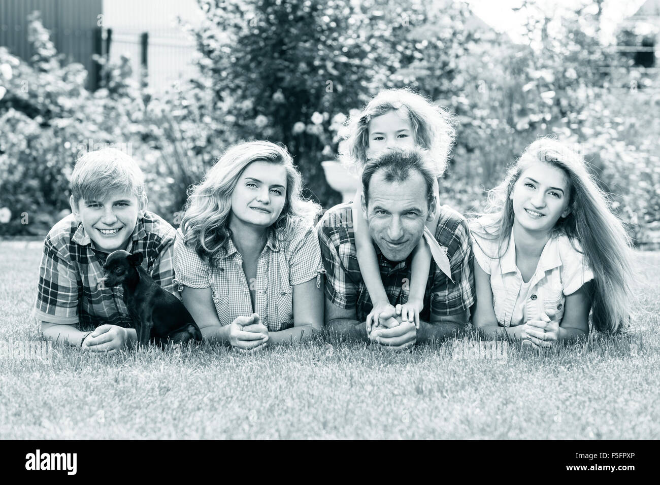 Happy family having weekend in summer park Stock Photo - Alamy
