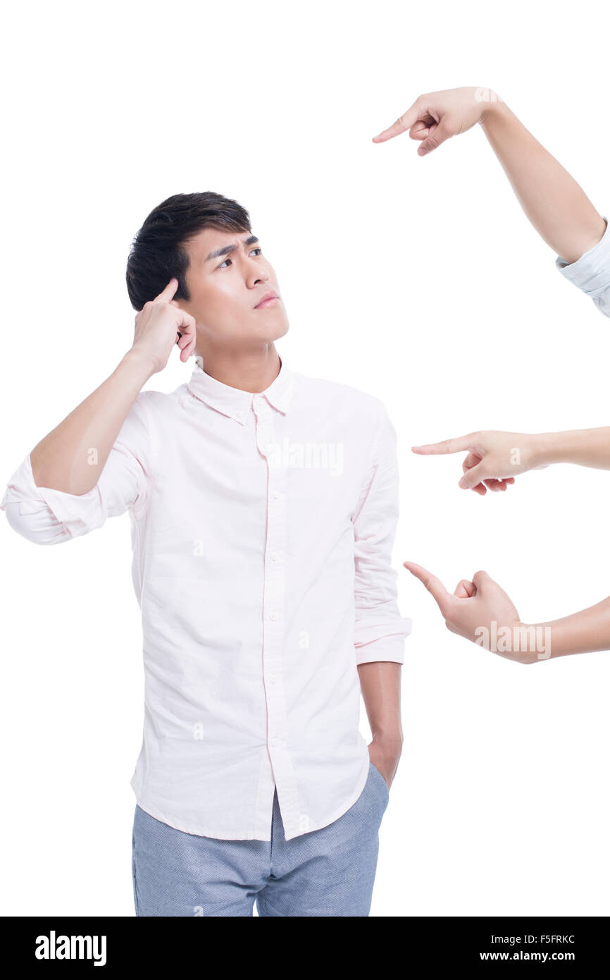 Hands pointing at a young man Stock Photo - Alamy