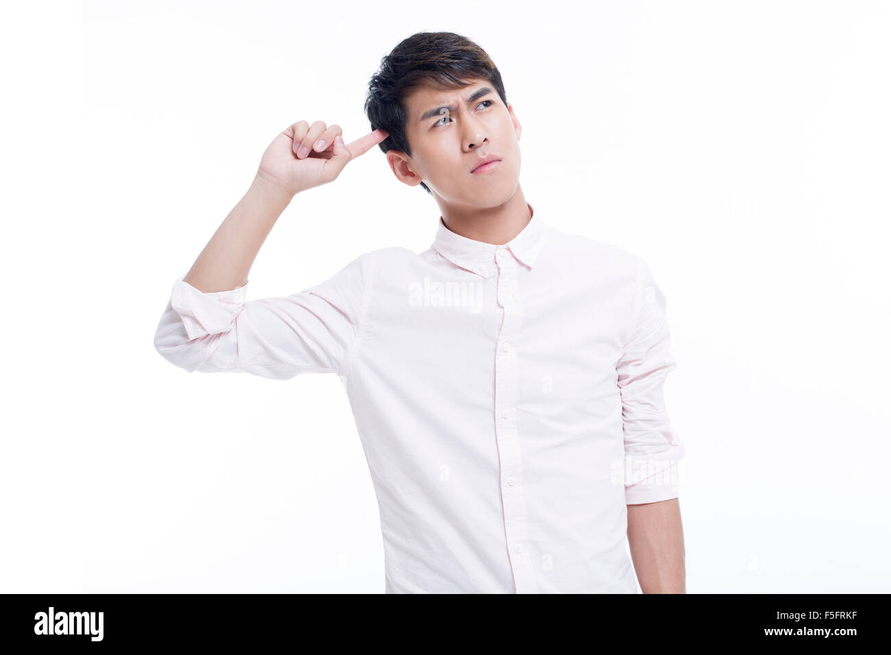 Young man thinking Stock Photo - Alamy