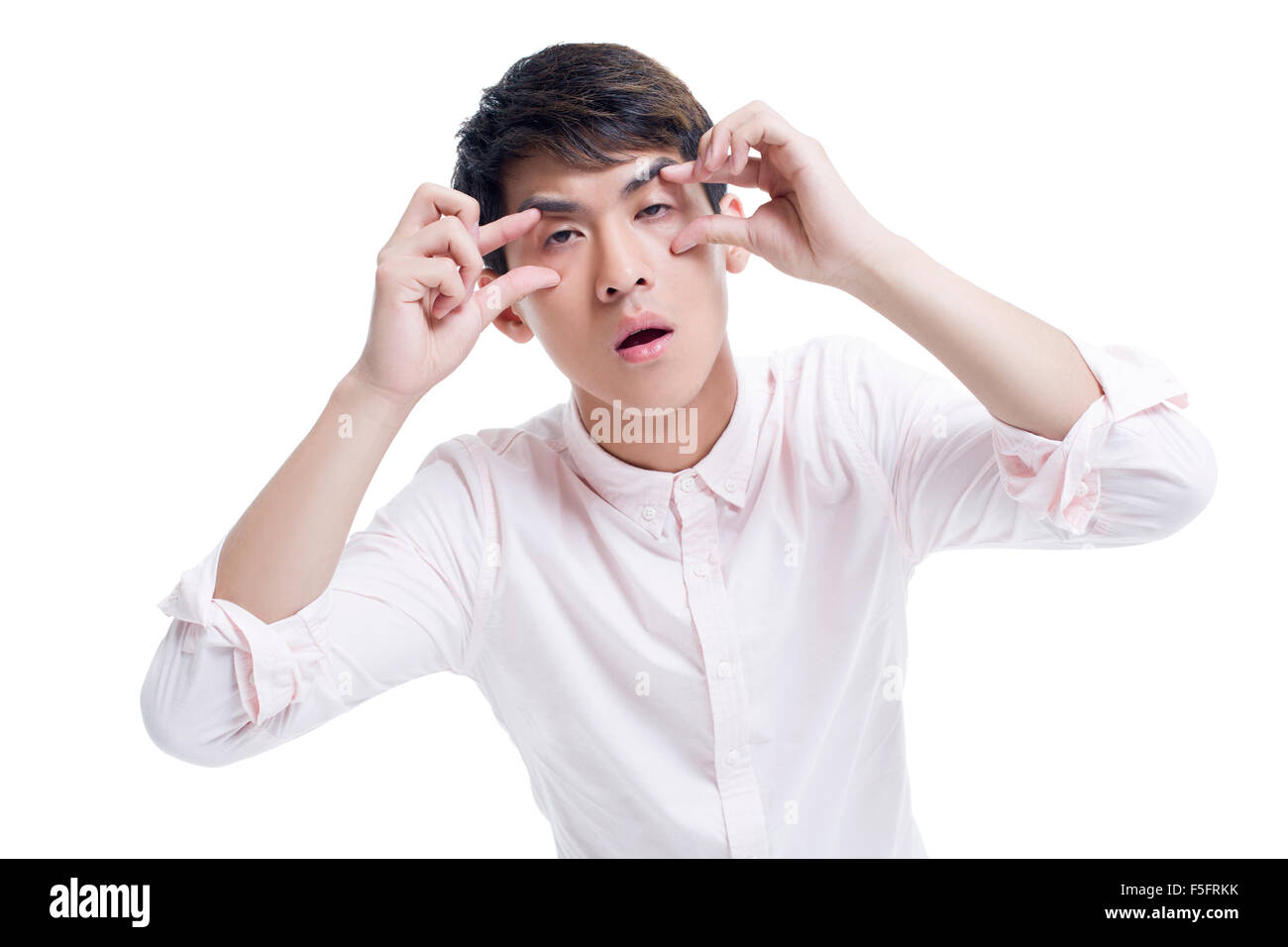 Tired man propping his eyes with hands Stock Photo - Alamy