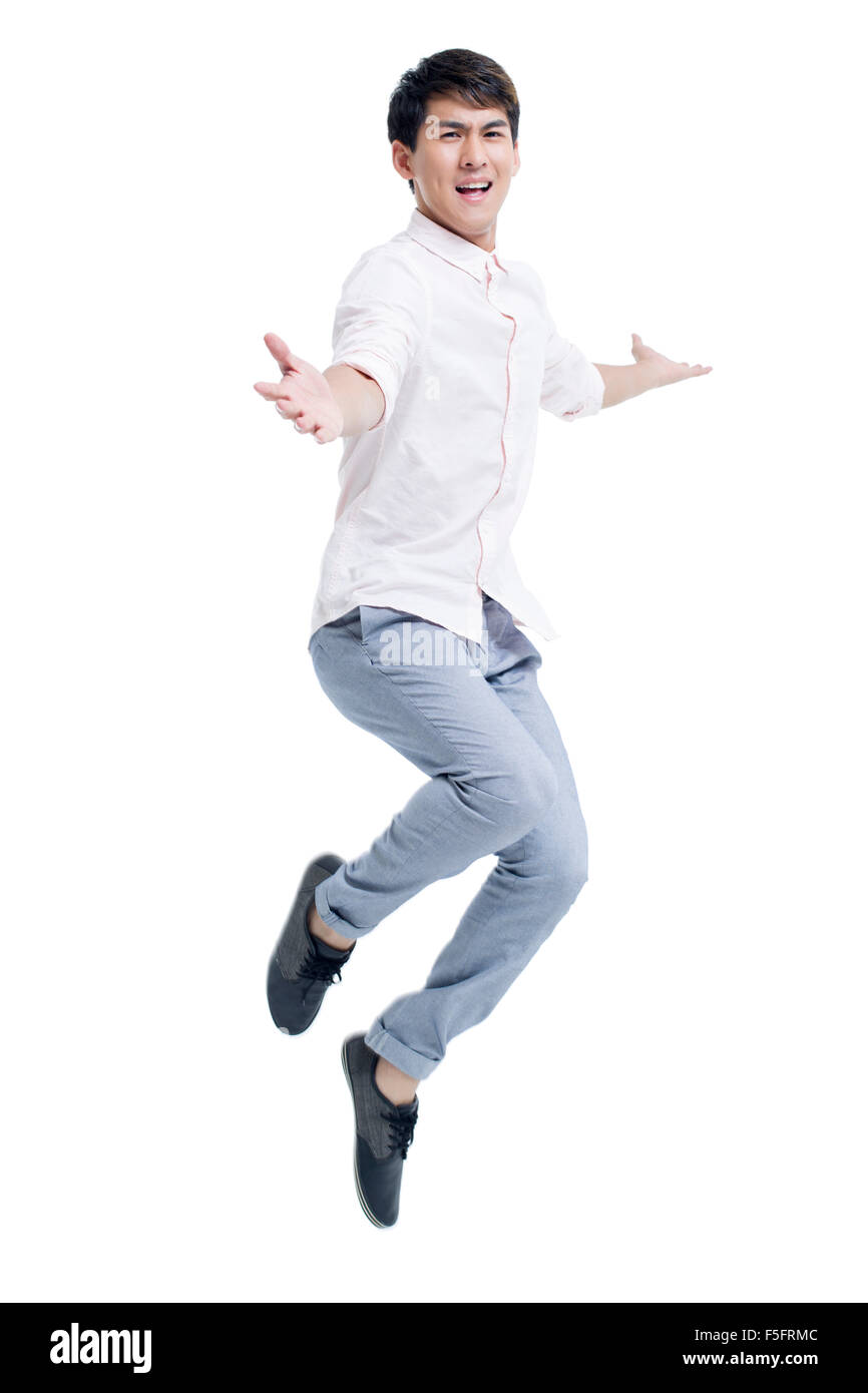 Young man jumping Stock Photo - Alamy