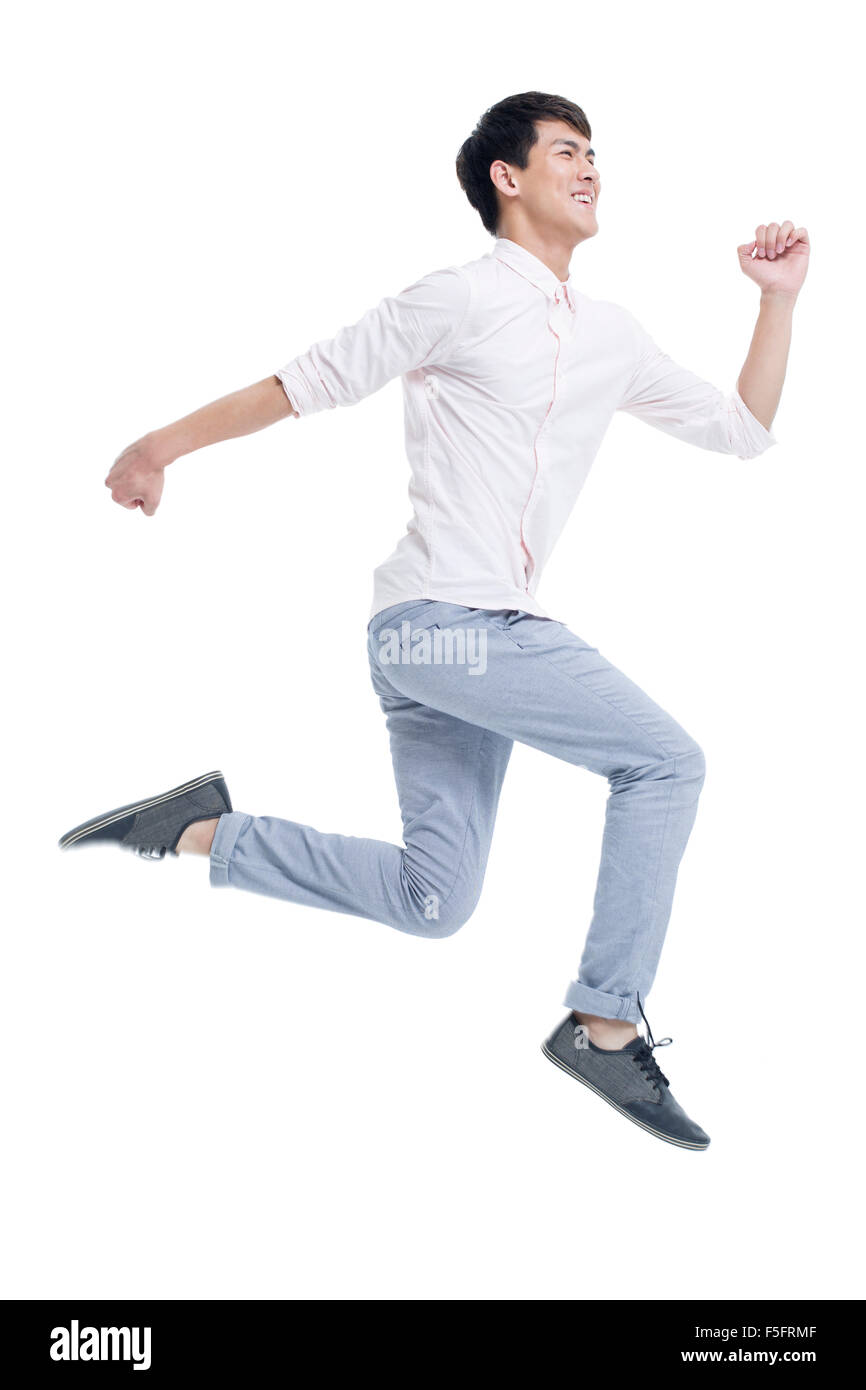 Young man jumping Stock Photo - Alamy