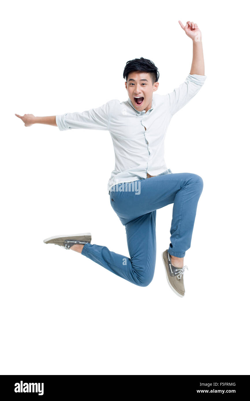 Young man jumping Stock Photo - Alamy