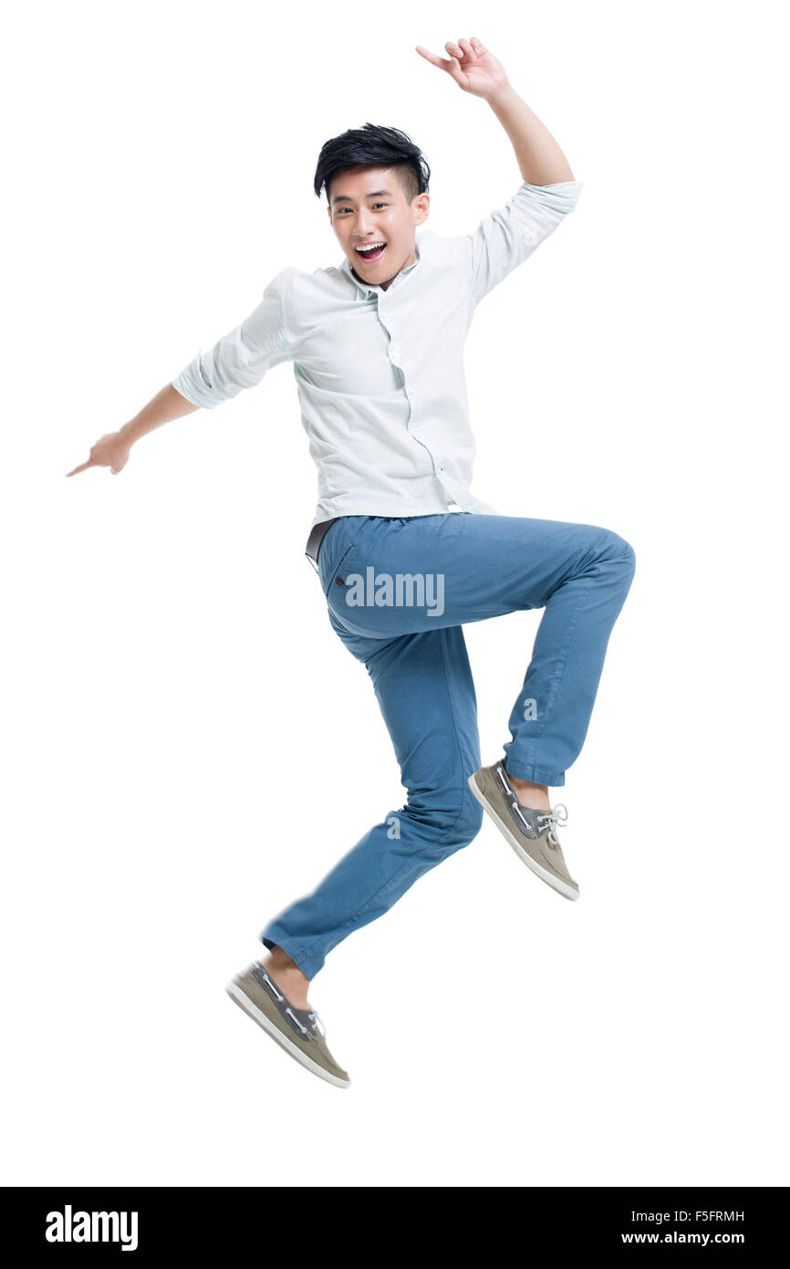 Young man jumping Stock Photo - Alamy