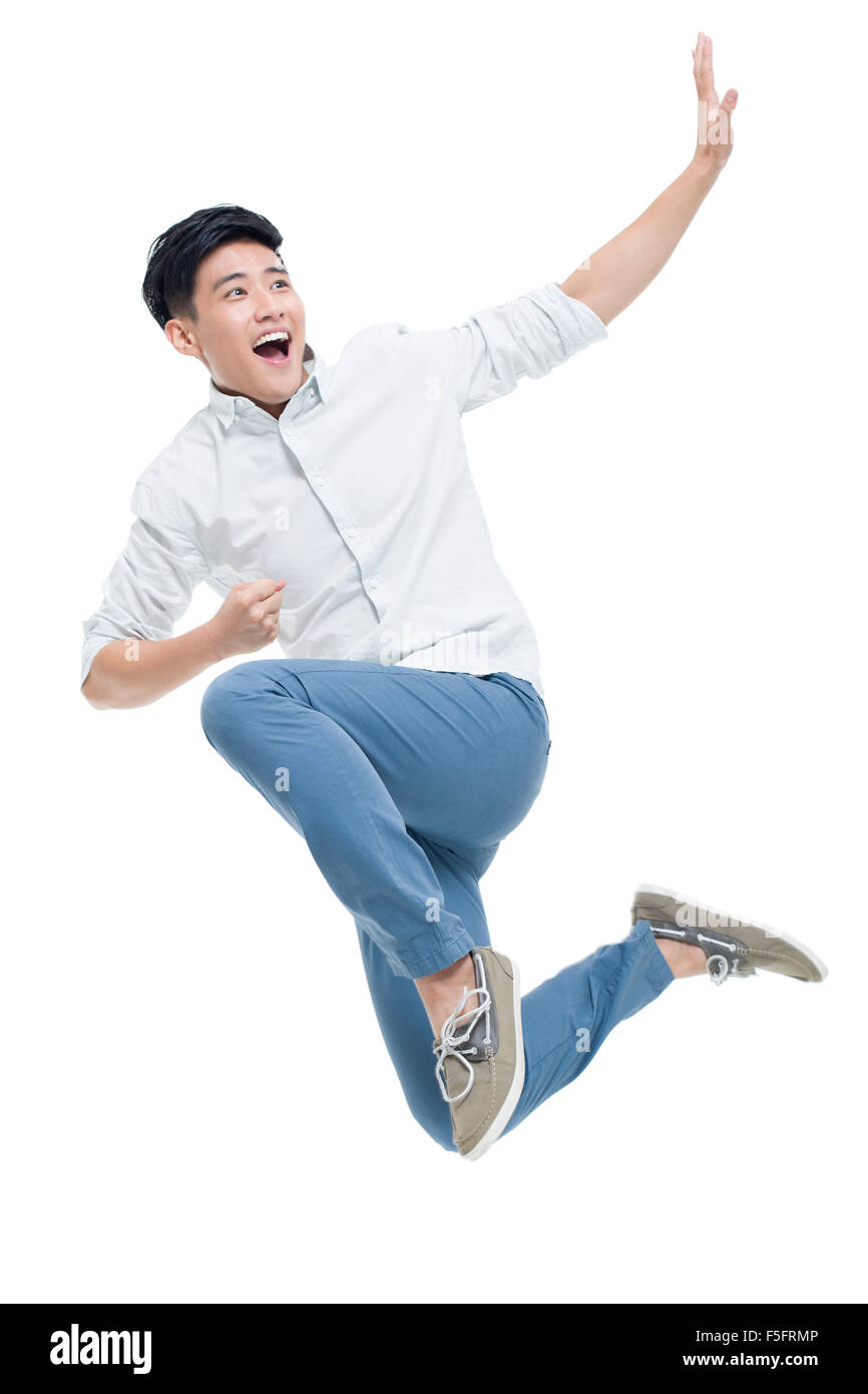 Young man jumping Stock Photo - Alamy