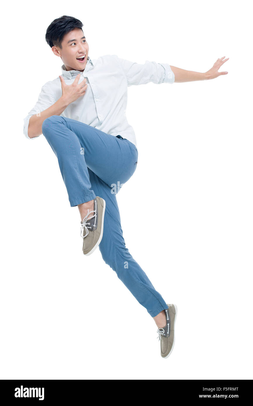 Young man jumping Stock Photo - Alamy