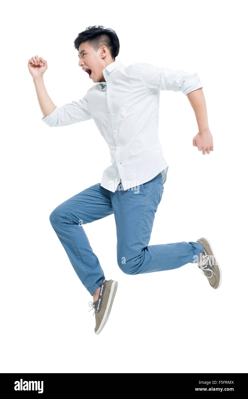 Young man running Stock Photo - Alamy