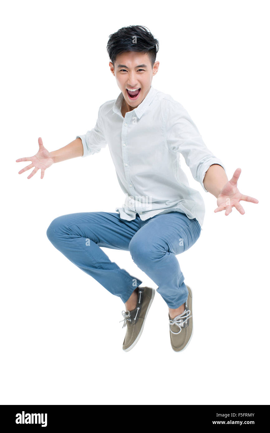 Young man jumping Stock Photo - Alamy