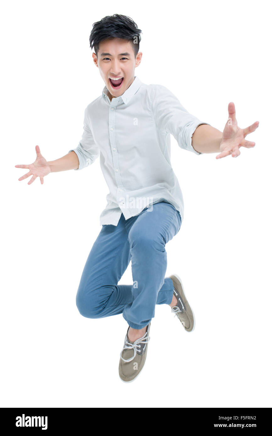 Young man jumping Stock Photo - Alamy