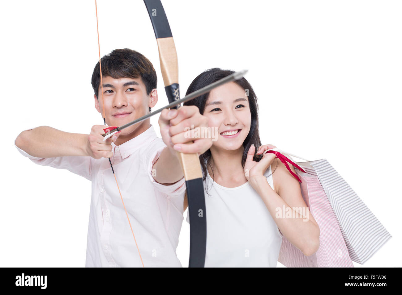 Young couple shopping with bow and arrow Stock Photo - Alamy