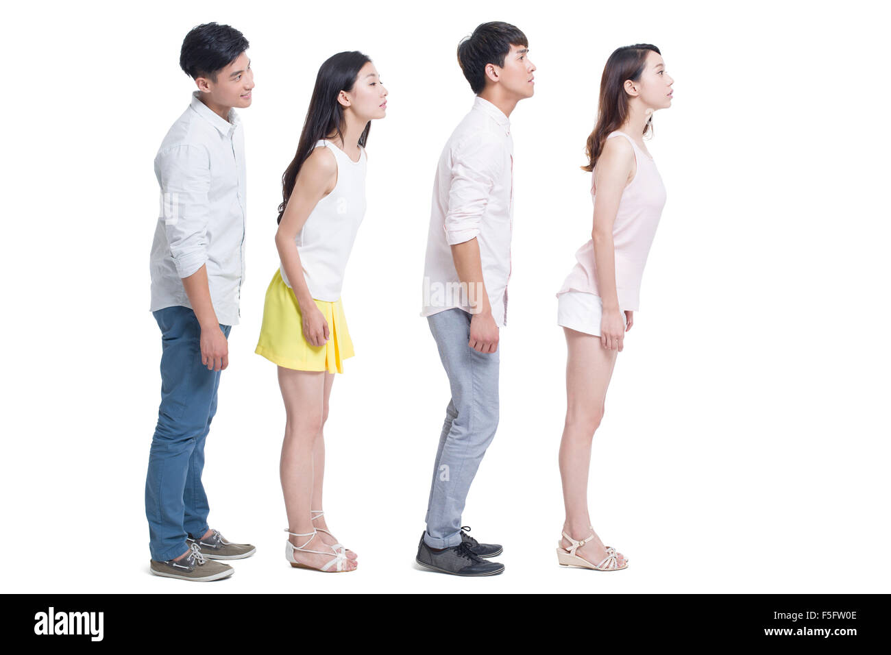 Young adults waiting in line Stock Photo - Alamy