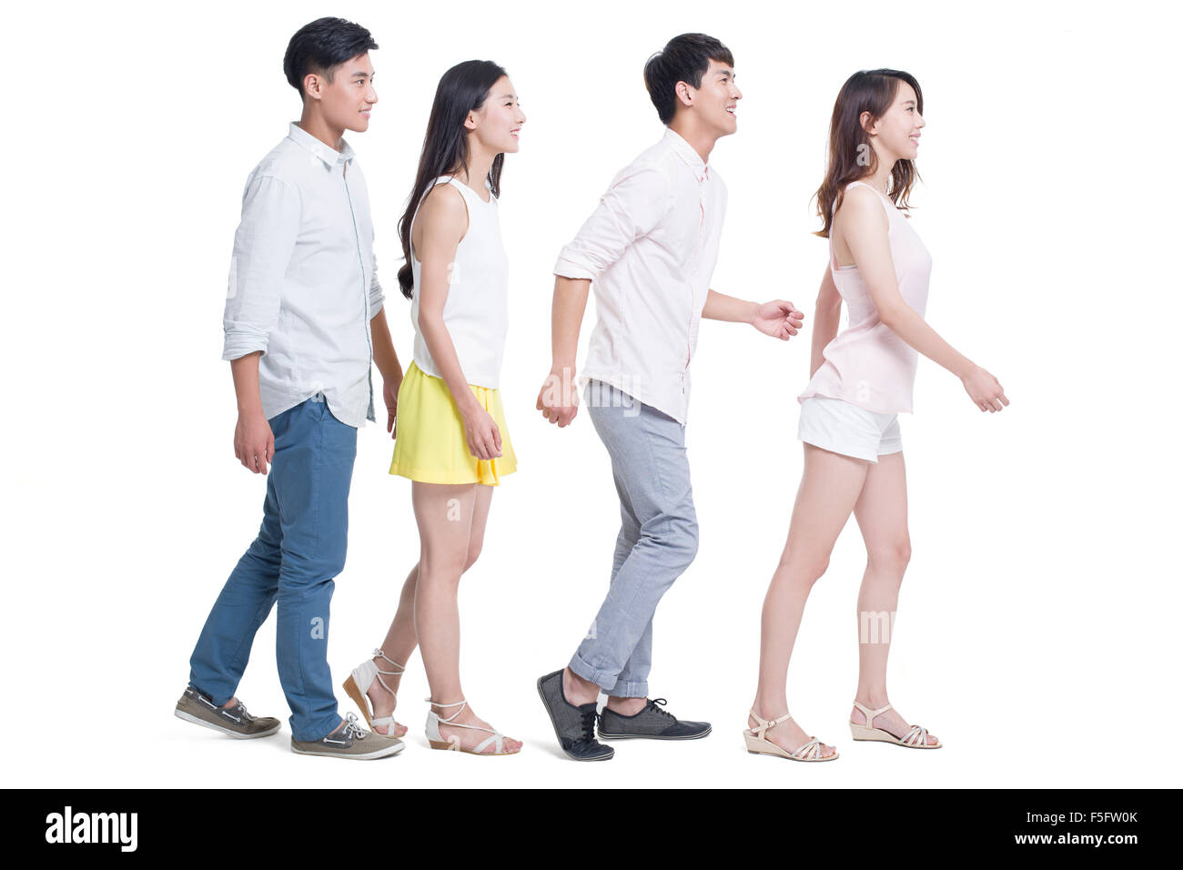 Indian student walking side view Cut Out Stock Images & Pictures - Alamy