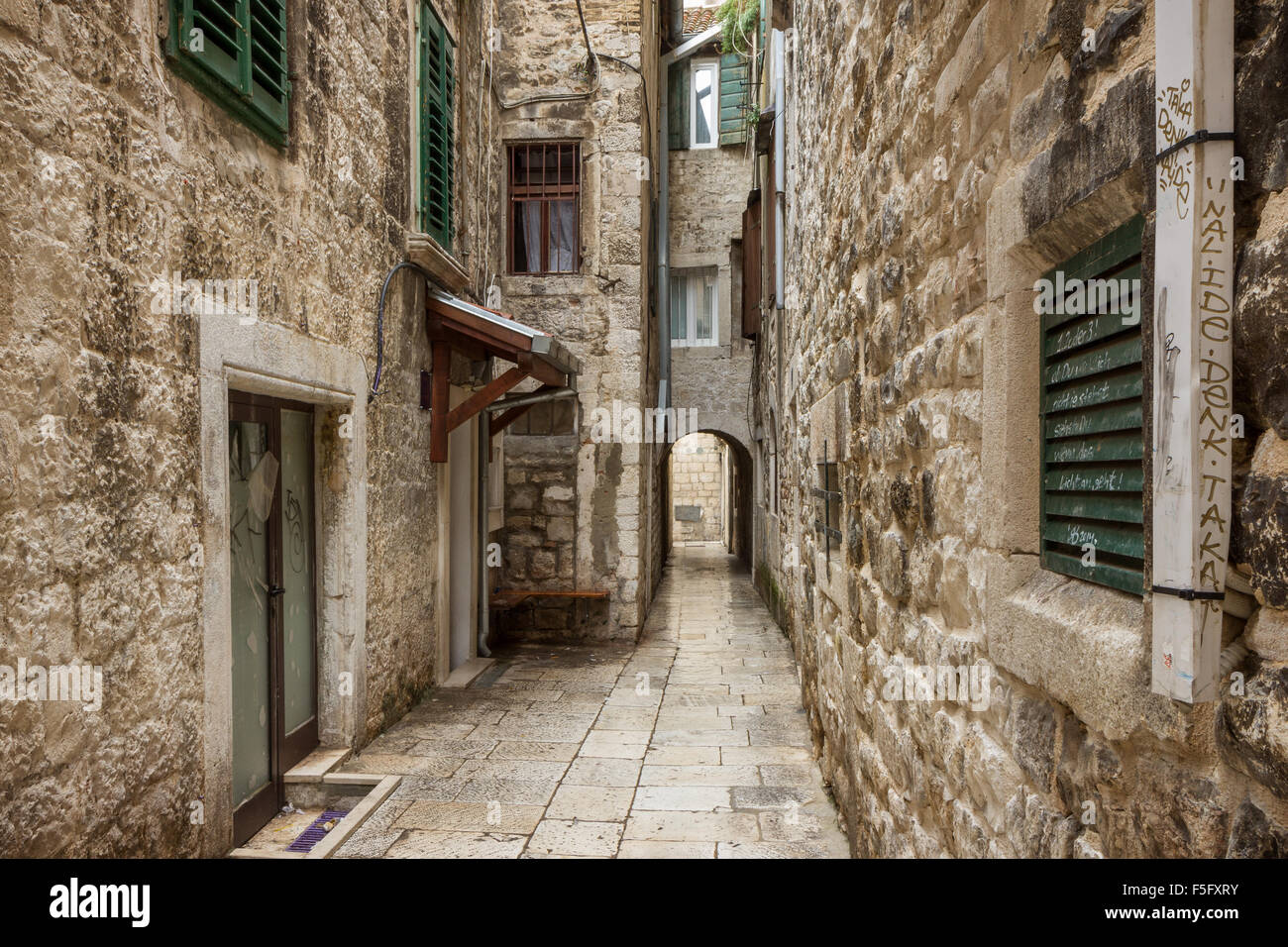 Narrow and empty alley or pedestrian street at the Old Town in Split ...
