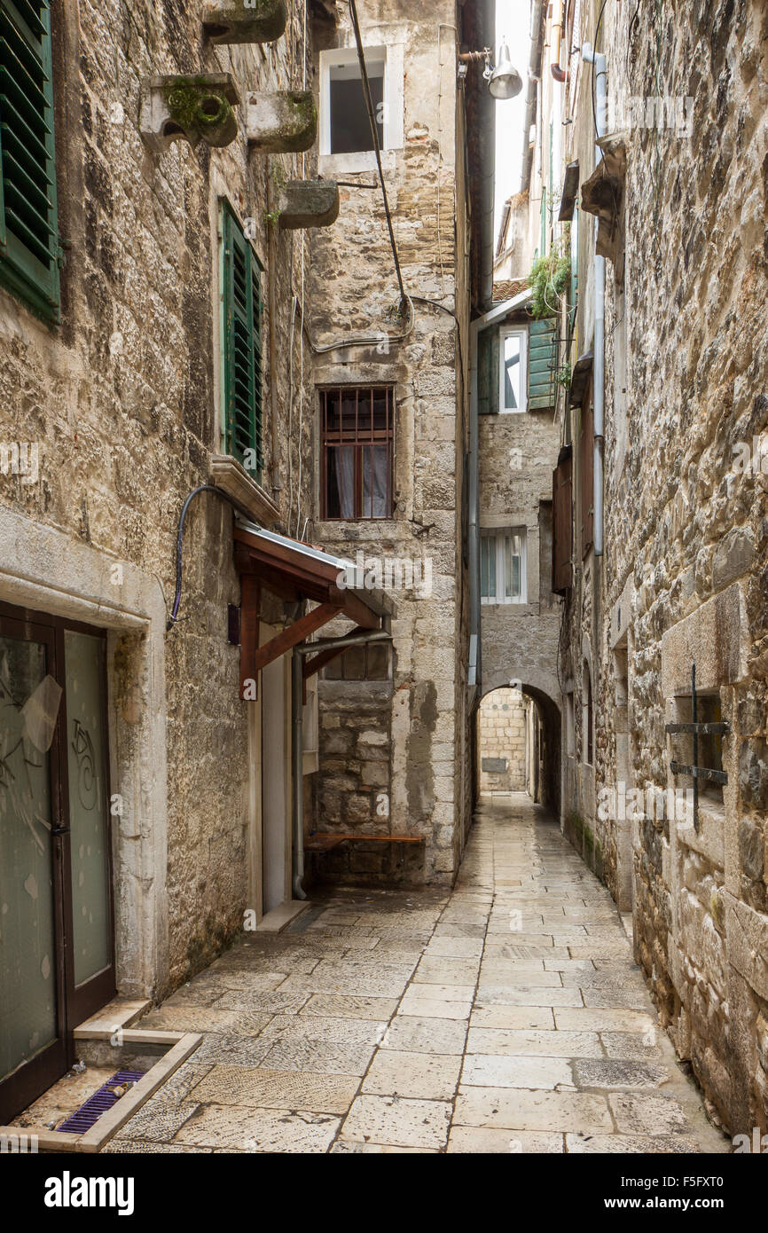 Narrow and empty alley or pedestrian street at the Old Town in Split ...