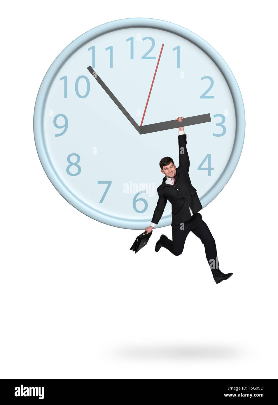 Man hang on clock isolated on white background Stock Photo - Alamy