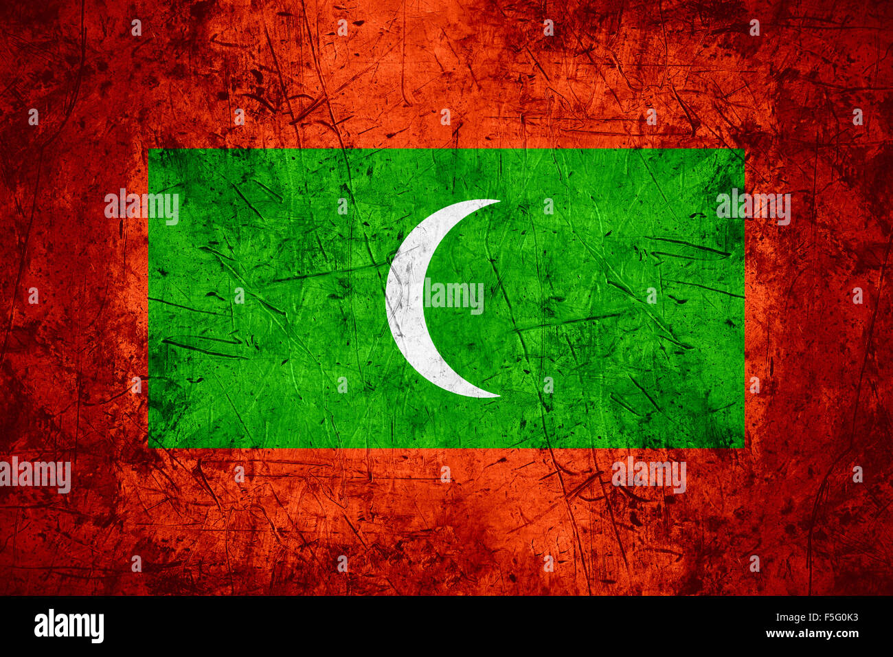 flag of Maldives or Dhivehi banner on rough pattern metal background ...