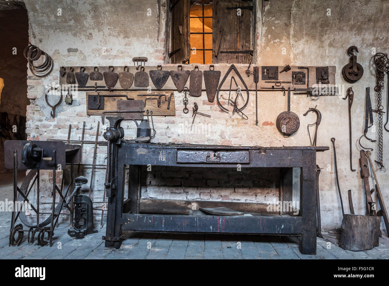 Old wooden workbench with tools Stock Photo - Alamy