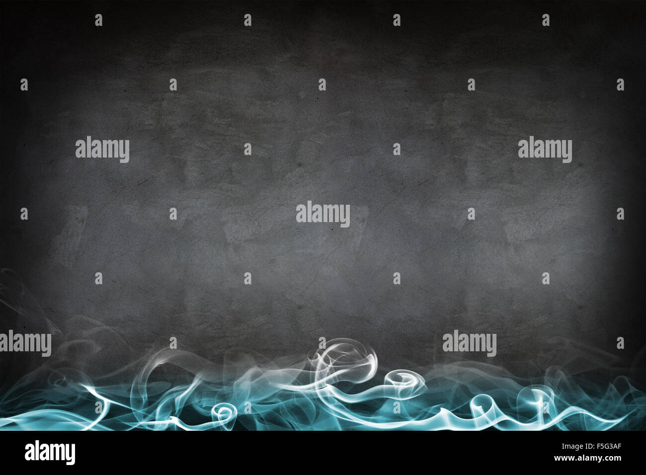 Abstract blue smoke on the gray wall Stock Photo - Alamy