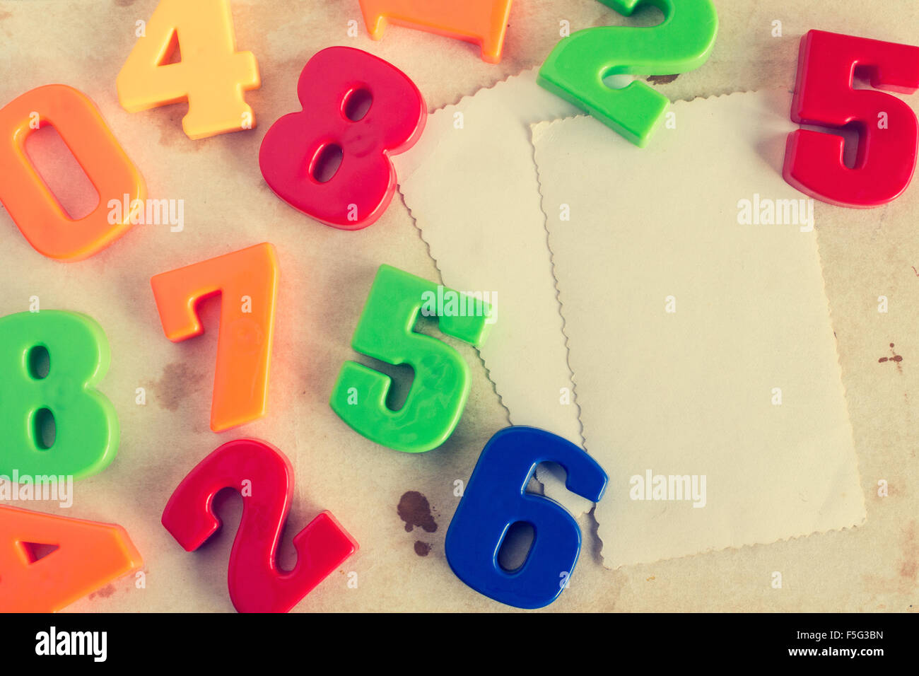 Colorful plastic numbers with empty cards for your text. Vintage image ...