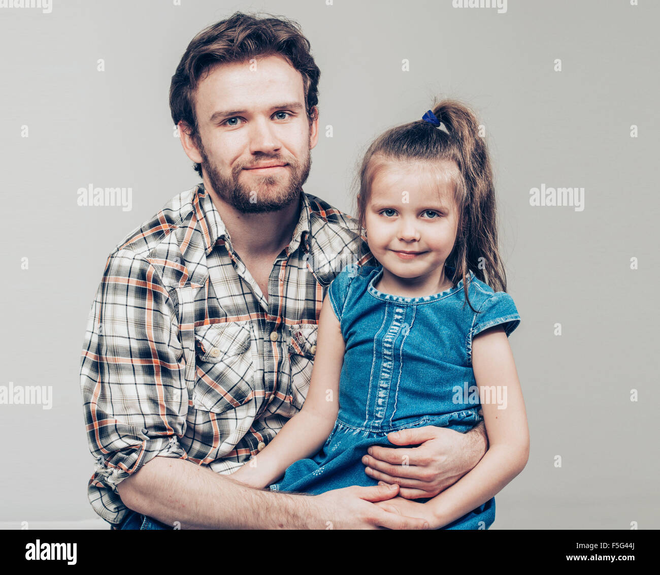 Daughter huge father studio portrait Stock Photo - Alamy