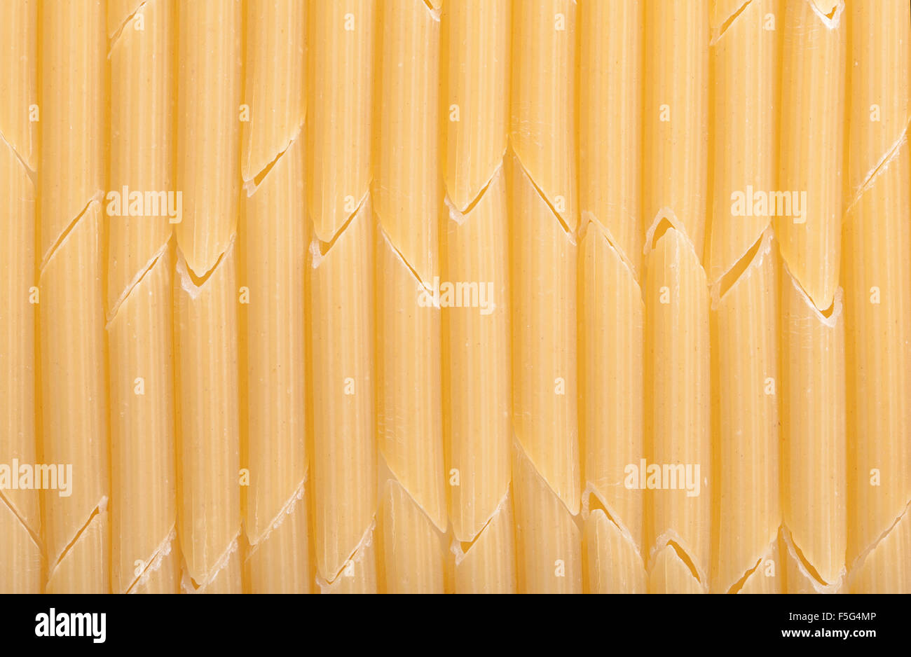 background the texture of raw pasta closeup Stock Photo - Alamy