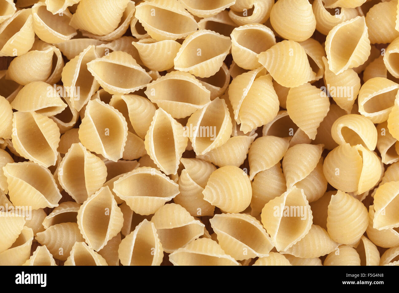 background the texture of raw pasta closeup Stock Photo - Alamy