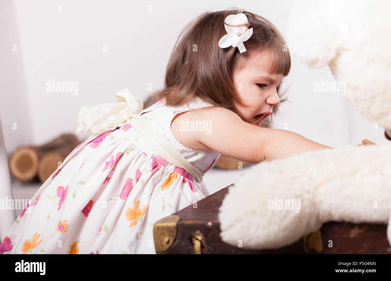 small girl screaming taking away the toy Stock Photo - Alamy