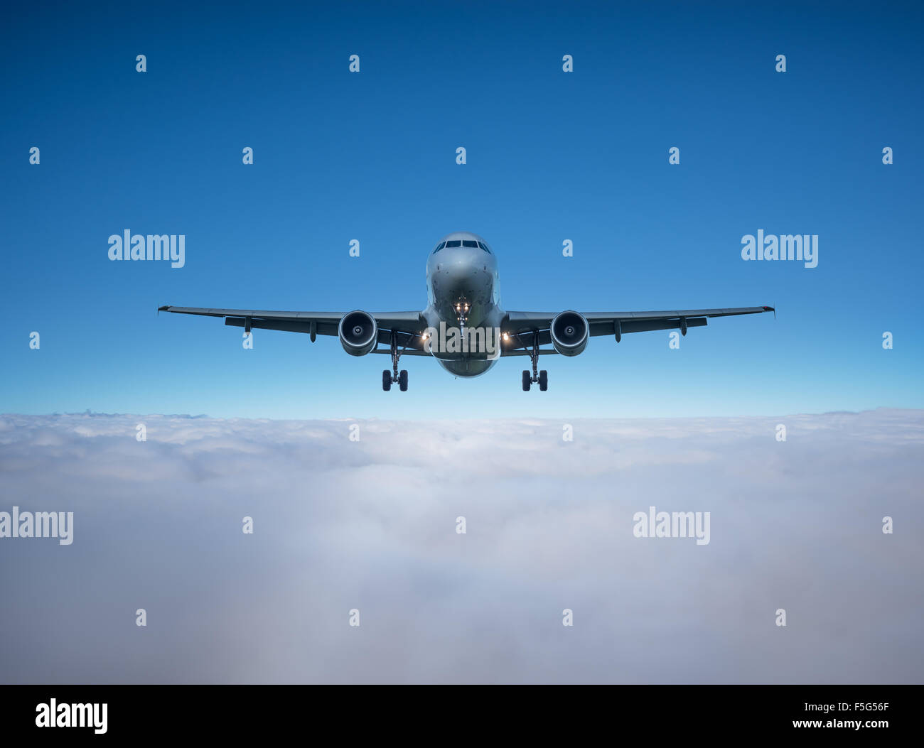 Flight of the plane above the clouds before landing Stock Photo - Alamy