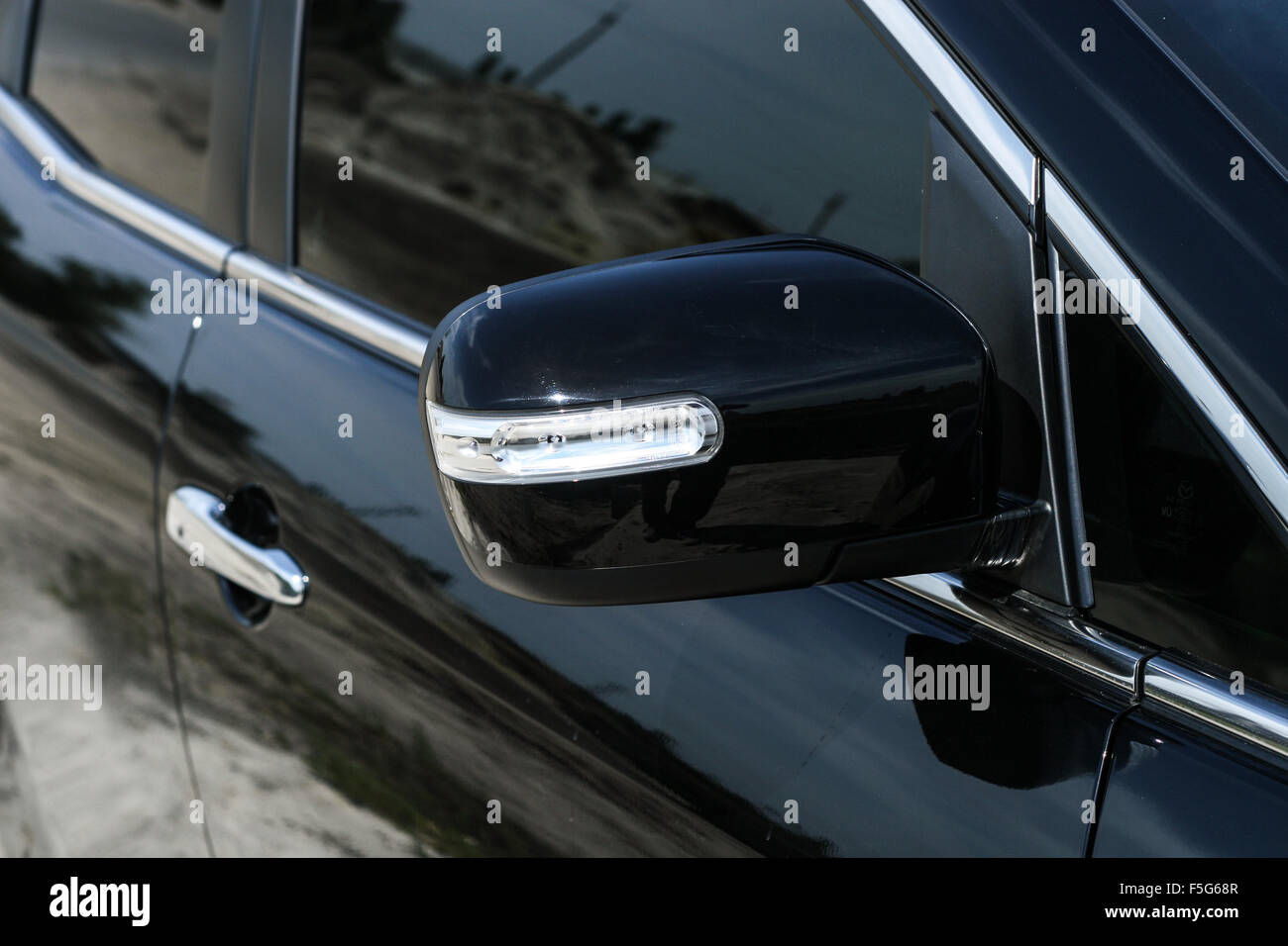 Modern turn signal on rear view mirror Stock Photo - Alamy