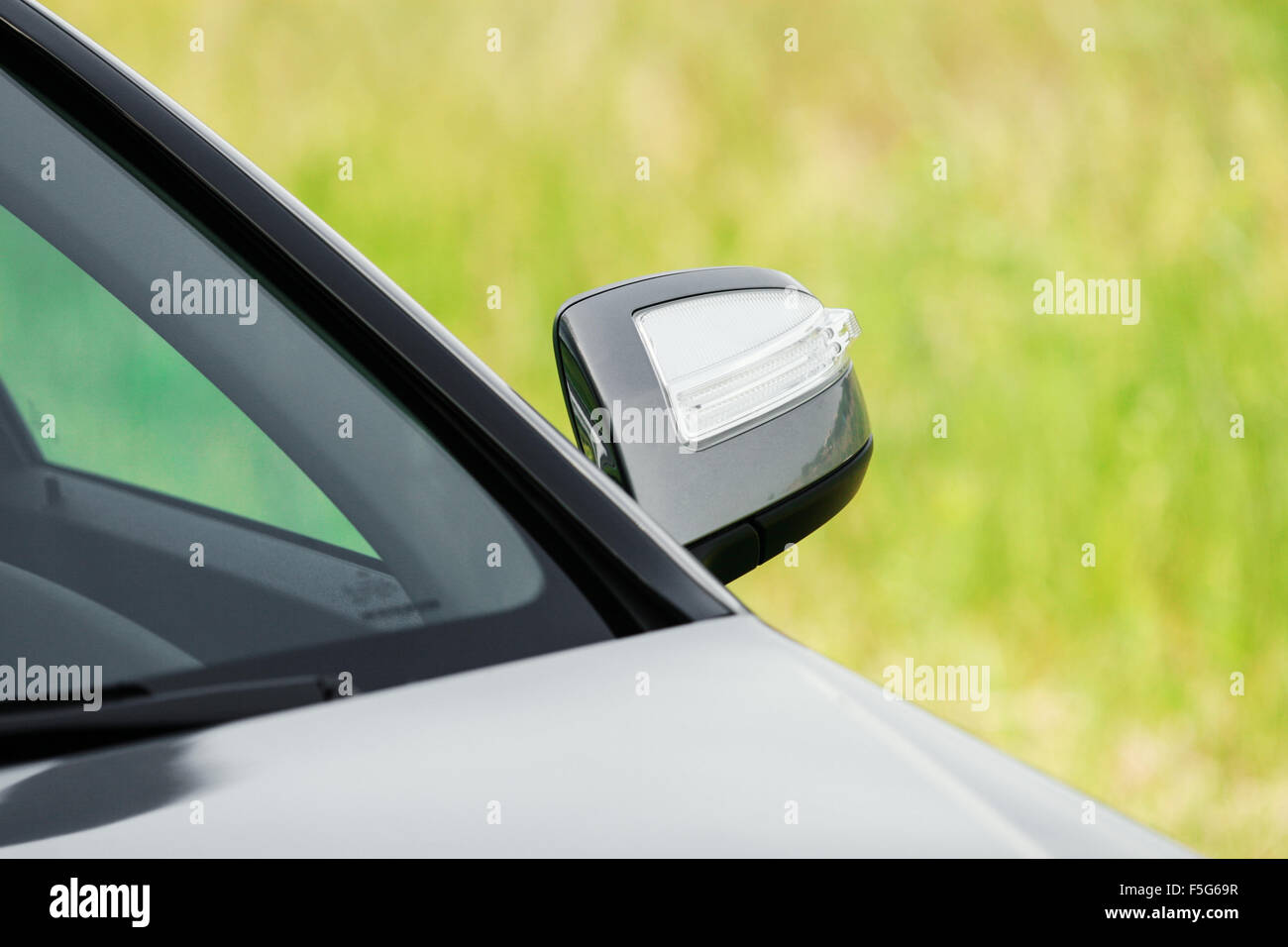 Modern turn signal on rear view mirror Stock Photo - Alamy