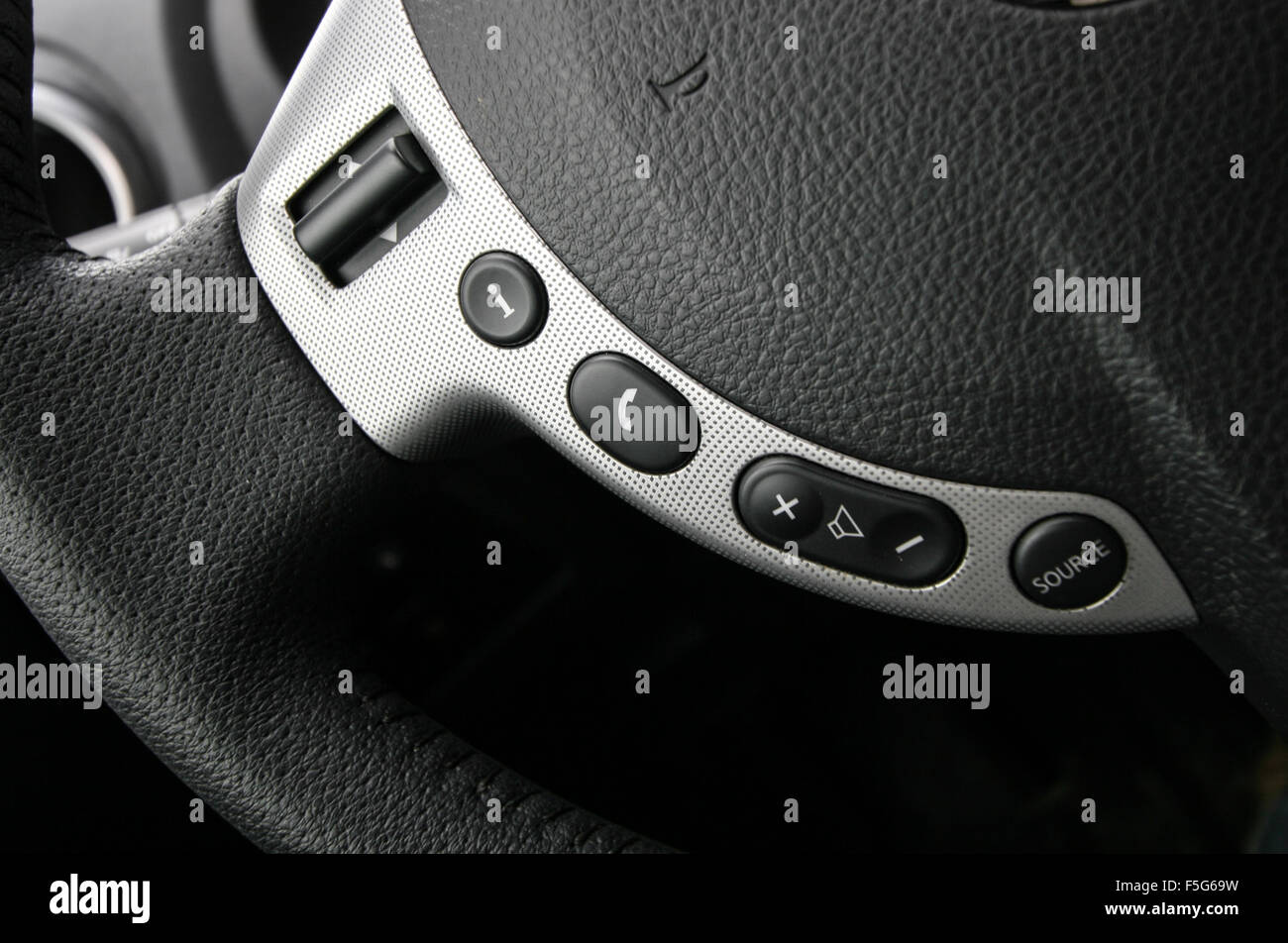 Control buttons on the steering wheel of a car Stock Photo - Alamy