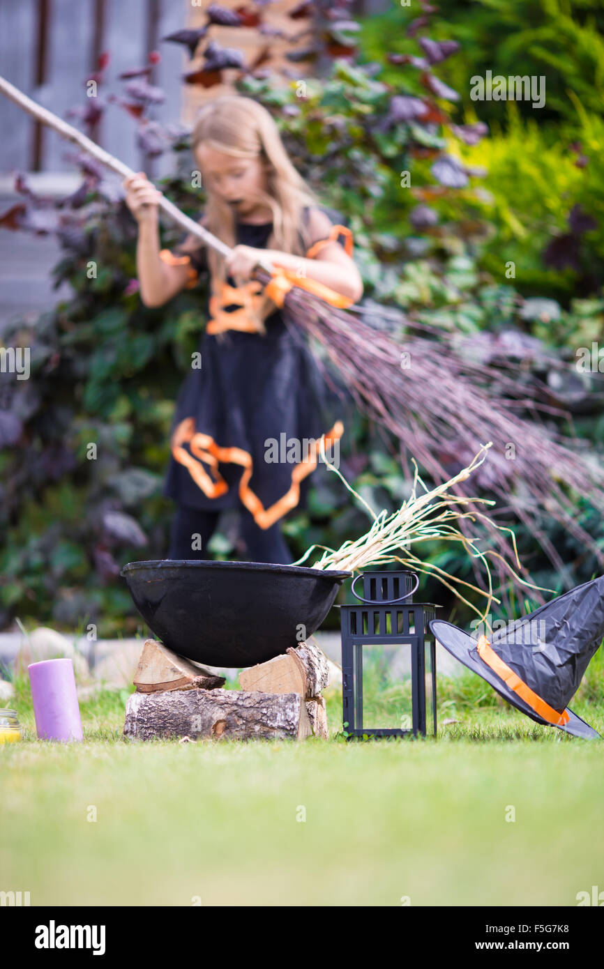 Happy little witch with broom on Halloween. Trick or treat Stock Photo ...