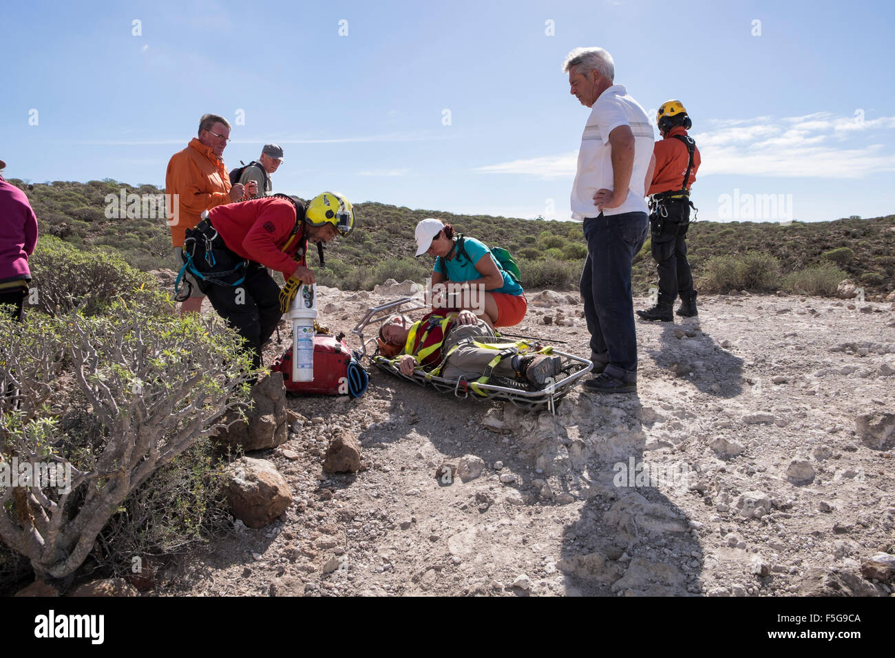 Helicopter rescue paramedics stabilising a patient before airlifting ...