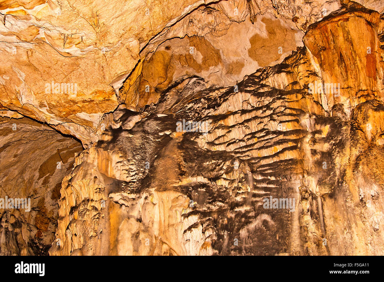 Inside view of an underground cavern or cave with stalagmites and ...