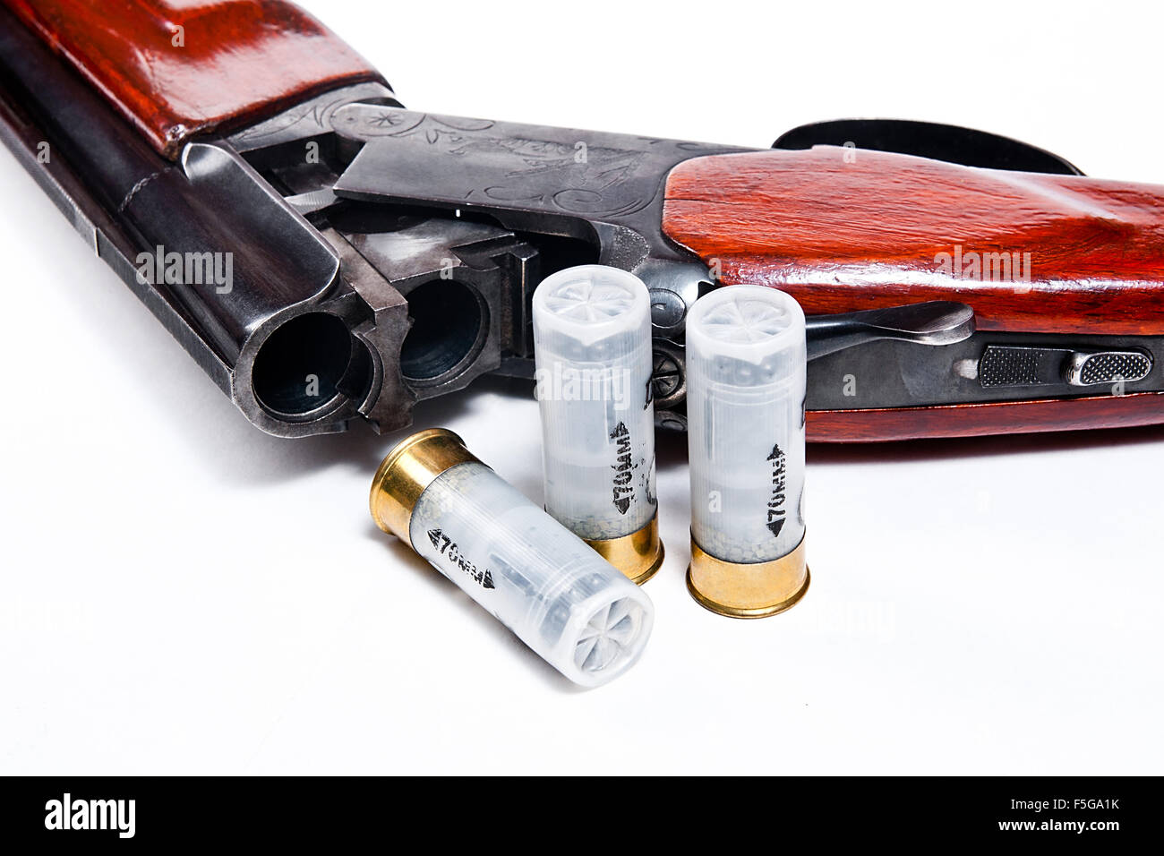 Hunting shotgun and ammunition on white background. Cartridges for ...