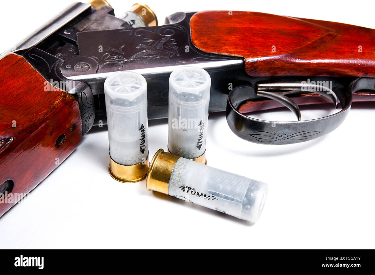 Hunting shotgun and ammunition on white background. Cartridges for ...
