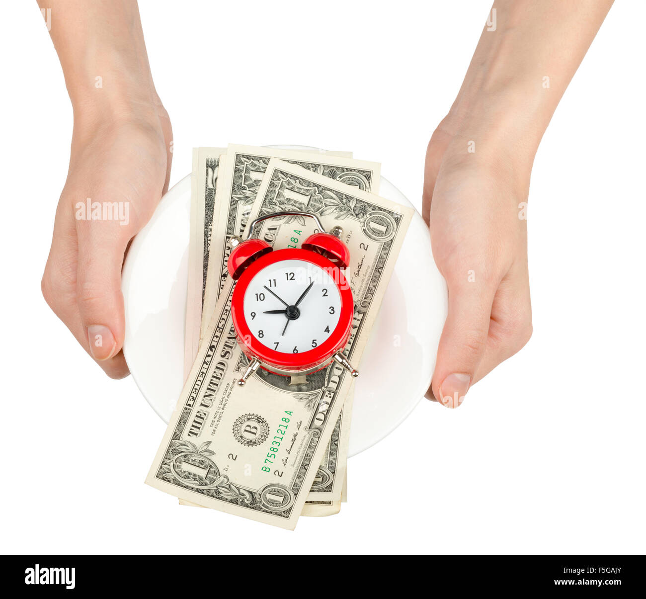 Womans hands holding saucer with cash and clock Stock Photo - Alamy