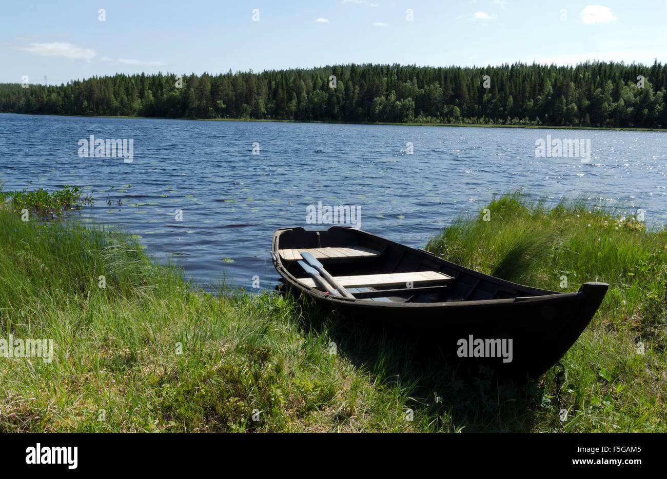 Rowing boat in a little lake in the North of Sweden Stock Photo - Alamy