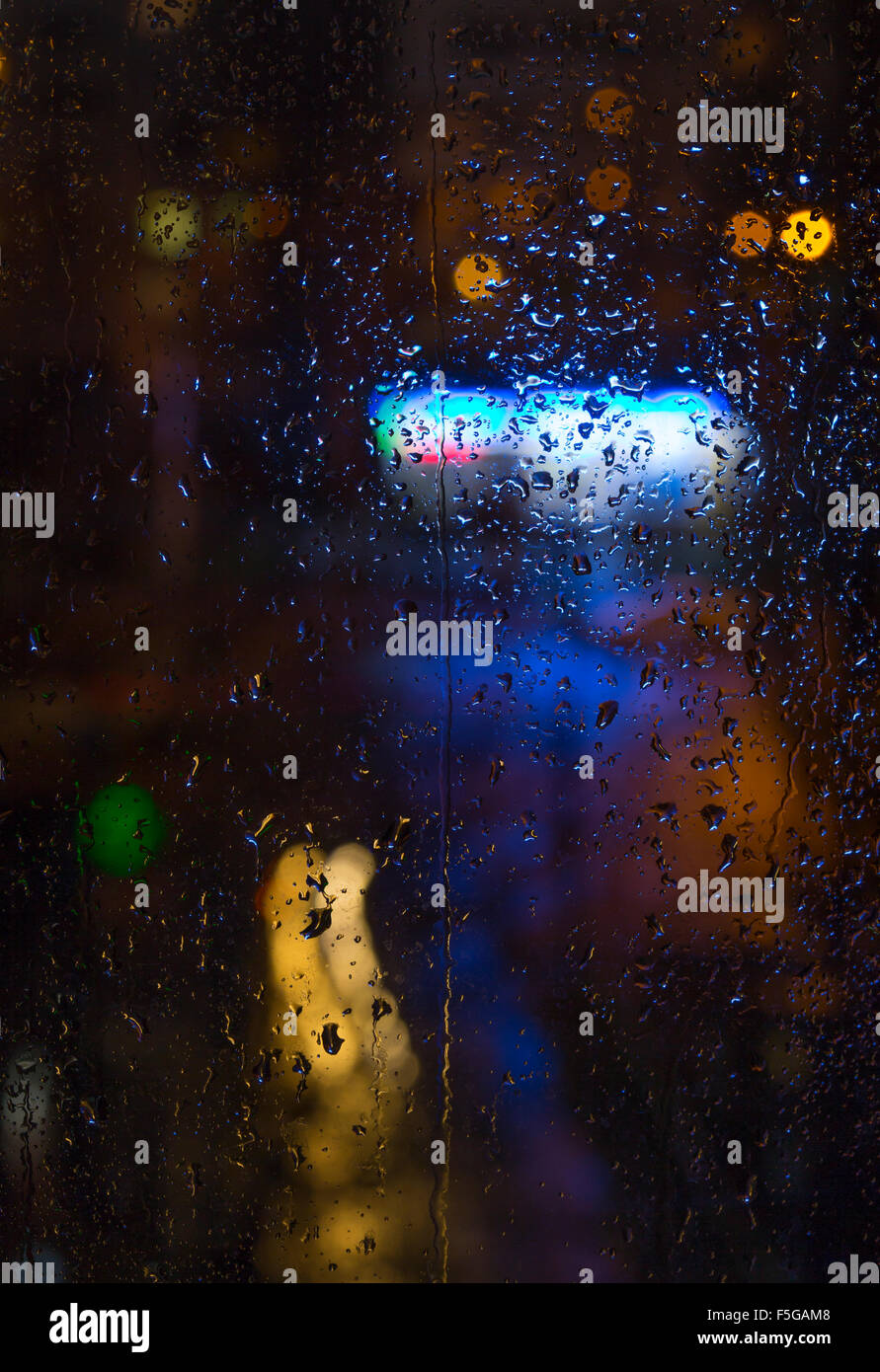 Rain drops and neon lights Stock Photo - Alamy