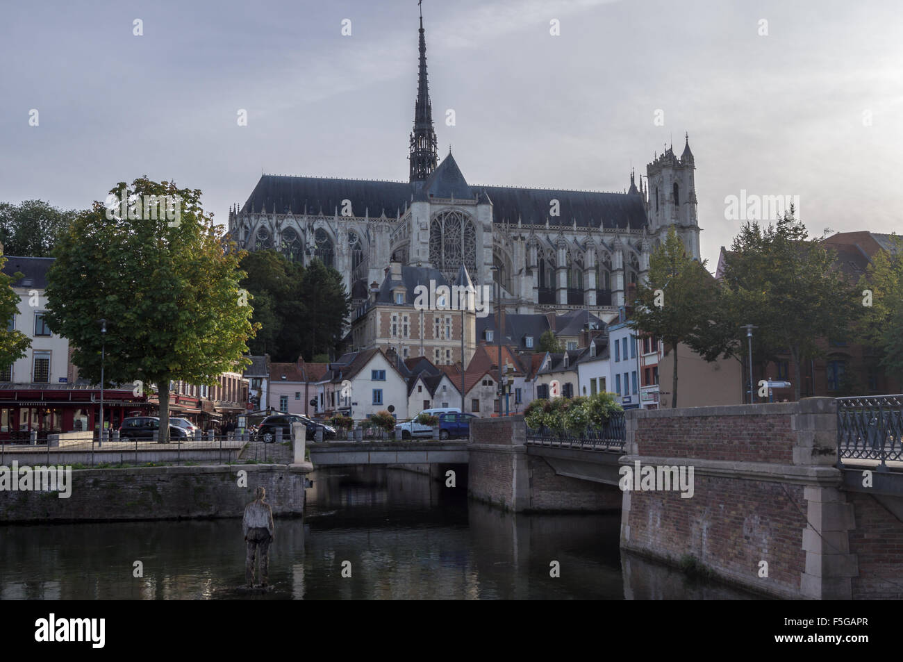 Notre-Dame cathedral, at sunset seen from Quai Belu, River Somme ...