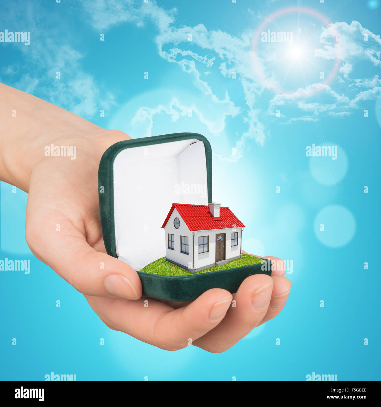 Empty ring box with house in girls hand Stock Photo - Alamy