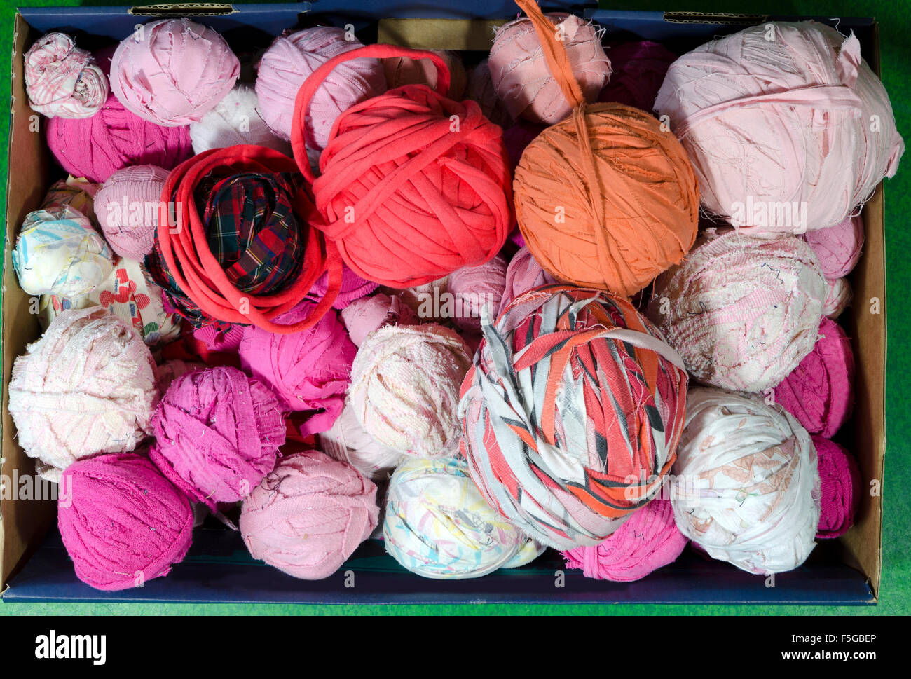 Rags of different color for use in a loom when weaving carpets, photo ...